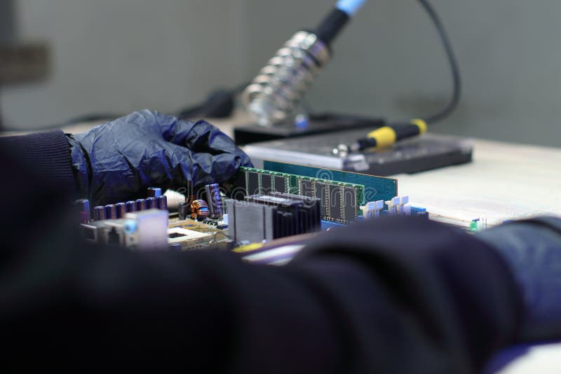 Inserting Ram into Motherboard from Computer on Table Stock Photo ...