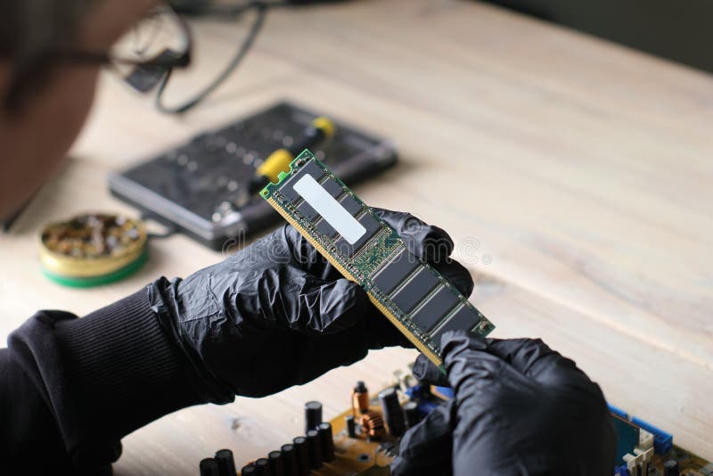 Inserting Ram into Motherboard from Computer on Table Stock Photo ... Inserting Ram into Motherboard from Computer on Table Stock Photo ...