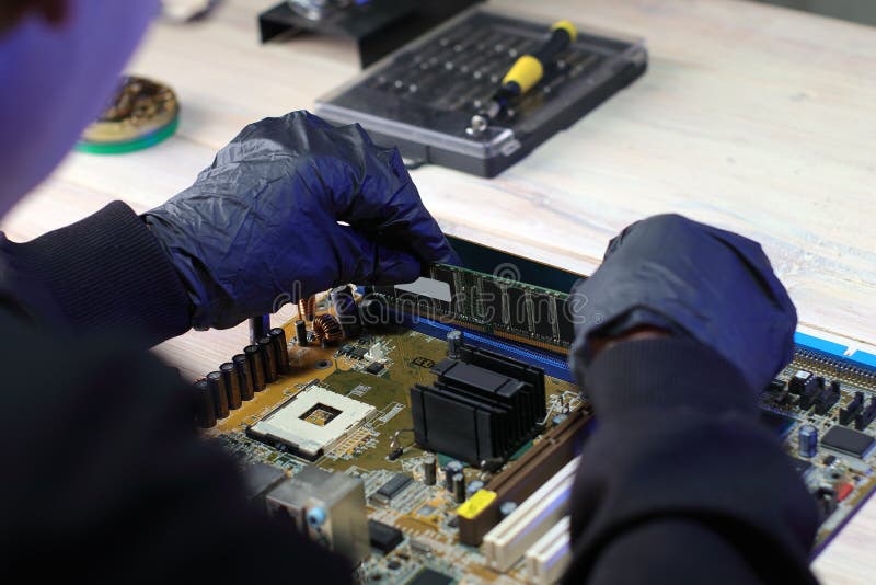 Inserting Ram into Motherboard from Computer on Table Stock Photo ... Inserting Ram into Motherboard from Computer on Table Stock Photo ...