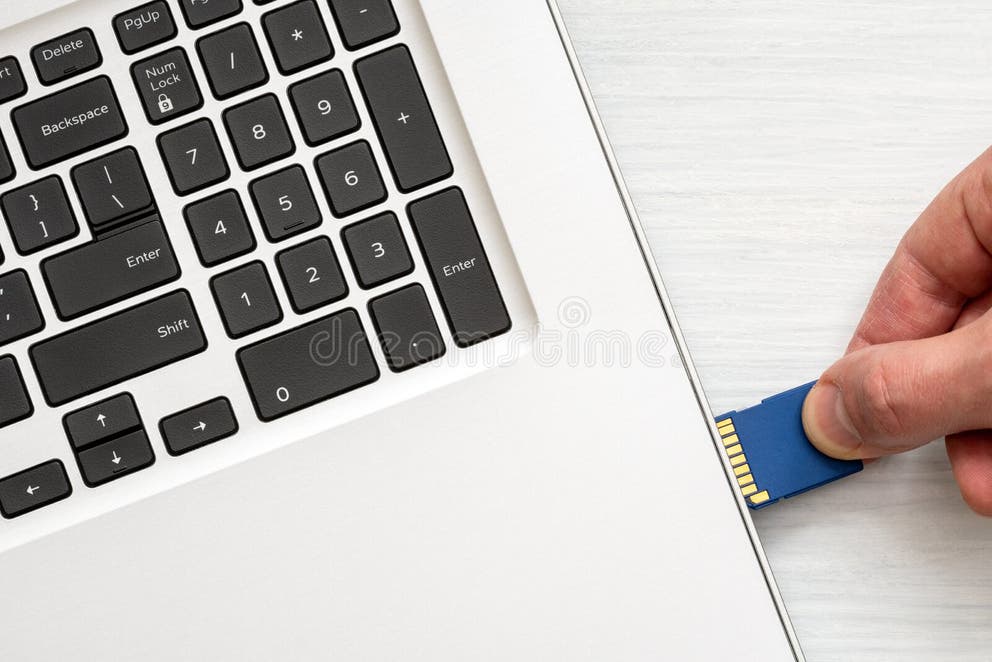 Inserting SD card stock photo. Image of hardware, hand - 142607974