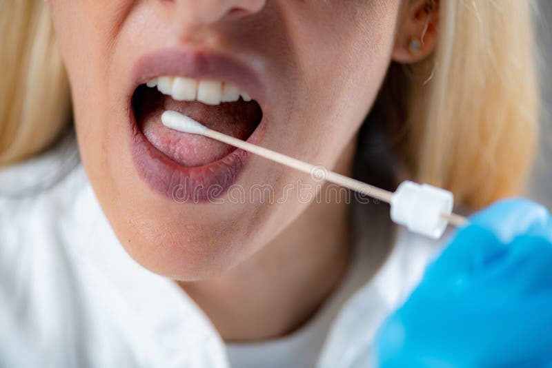 Inserting a Swab into the Mouth, Collecting a Saliva Sample for DNA ...