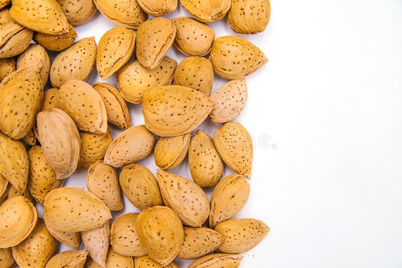 Inshell Almonds on a White Background. Almonds are Arranged in a Pile ...