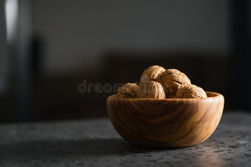 Inshell Walnuts in Olive Wood Bowl on Terrazzo Countertop Stock Photo ...