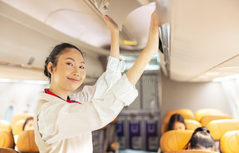 Inside an Airplane, a Beautiful Air Stewardess Stock Image - Image of ...