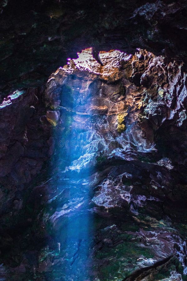 Inside of a Beautiful Cave with a Hole and Sunlight Shining through ...