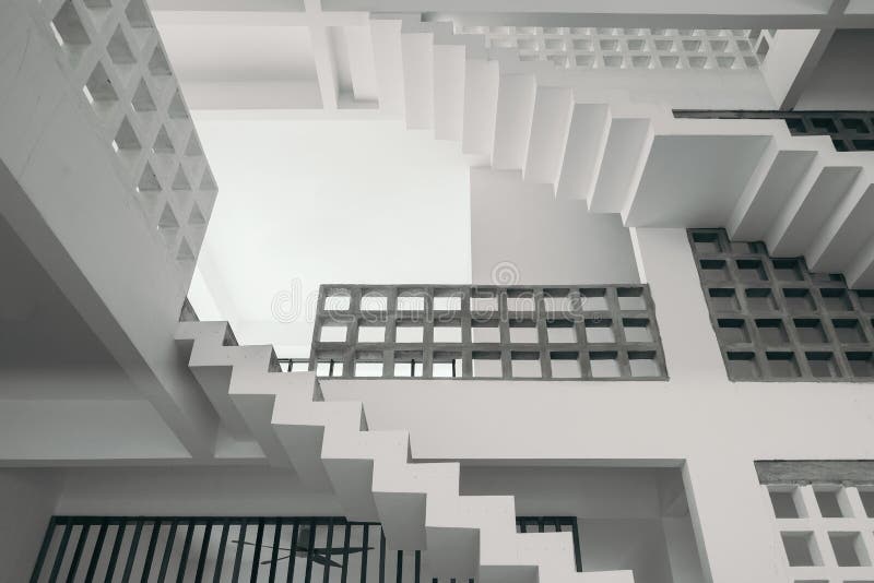 Inside of a Building with White Stairs and Gray Square Decorative Walls ...