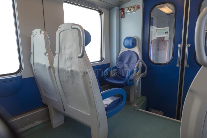 Inside the Cab of the Modern Express. Nobody in Blue Chairs by the ...