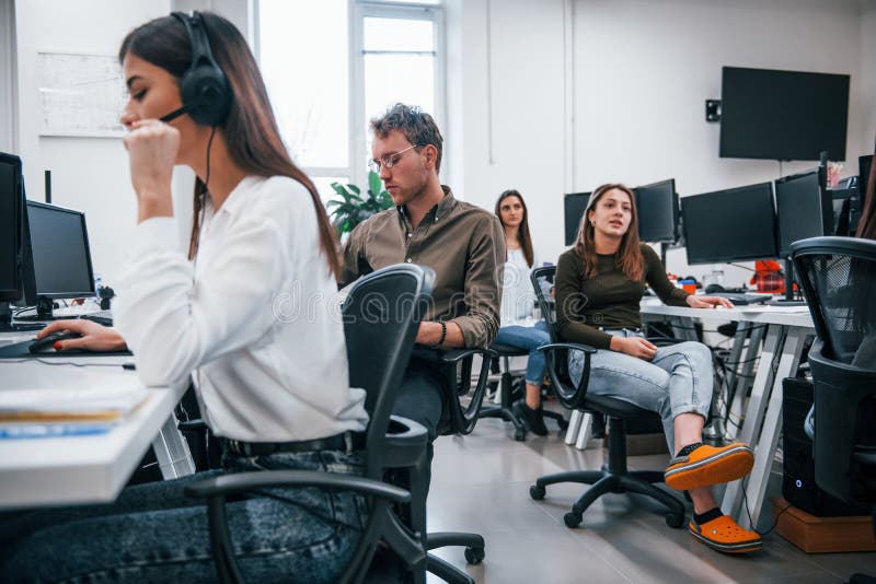 Inside of Call Center. Young Business People Working Together in the ...