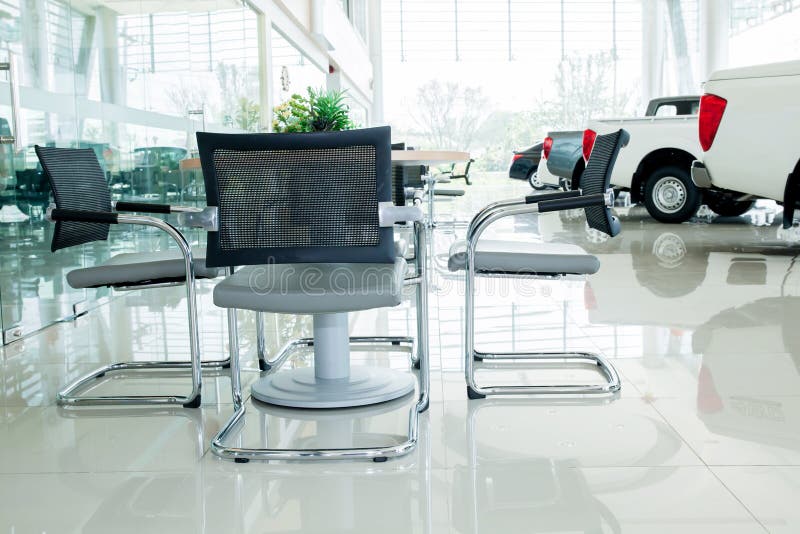 Inside Car Showroom Interior with Group of Chairs and Table Stock Photo ...
