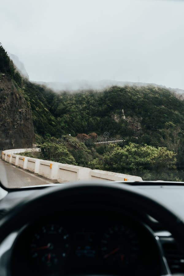 Inside Car View Driving Down a Winding Road with a Mountain in the ...
