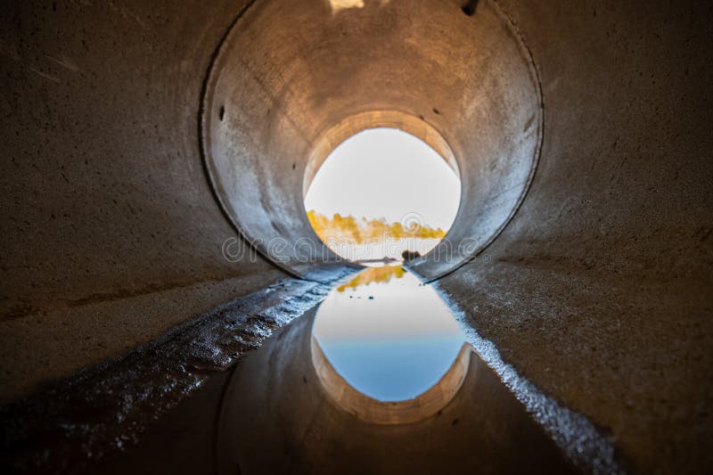 Inside a Circular Concrete Drainage Culvert with a Trickle of Water ...