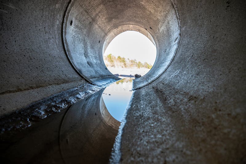 Inside a Circular Concrete Drainage Culvert with a Trickle of Water ...