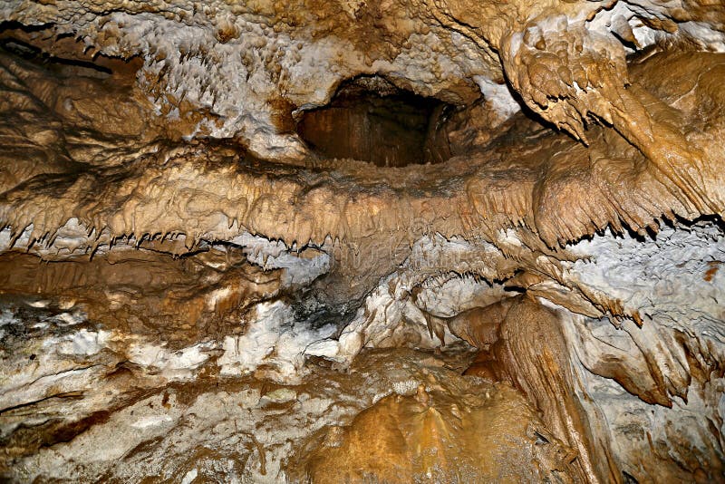 Inside a deep cave stock photo. Image of stalagmite, brown - 81709504