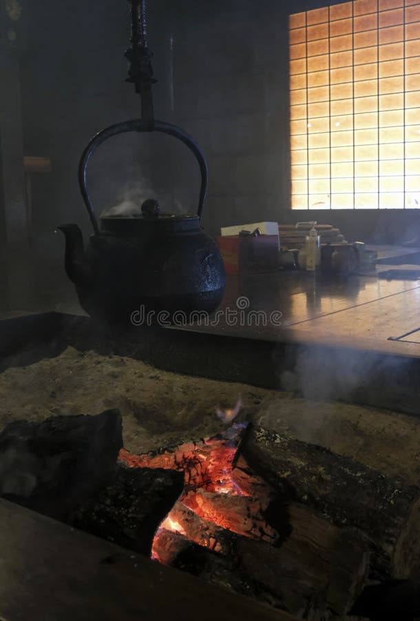 Inside a Dimly Lit Traditional Japanese House with Fire Pit and Tea ...