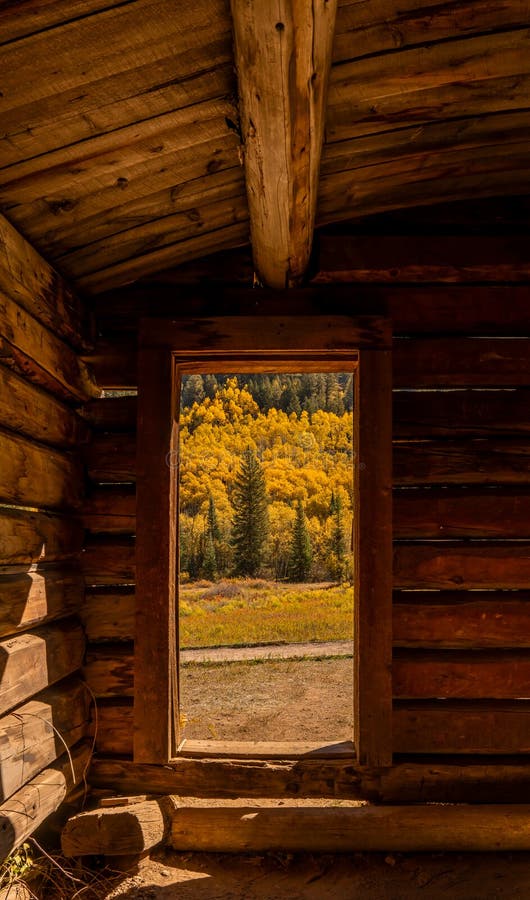Inside Doorway of Colorado Log Cabin with Peak Fall Colors Stock Photo ...