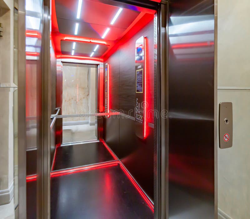 Inside an Elevator Lift Cabin with Red Light Reflection Lines in the ...