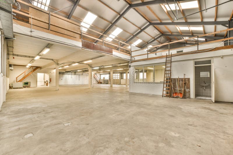 The Interior of a Large Warehouse with a Concrete Floor Stock Photo ...