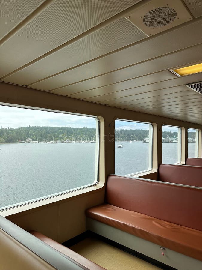 The Inside of an Empty Passenger Ferry is Shown with Several Benches ...