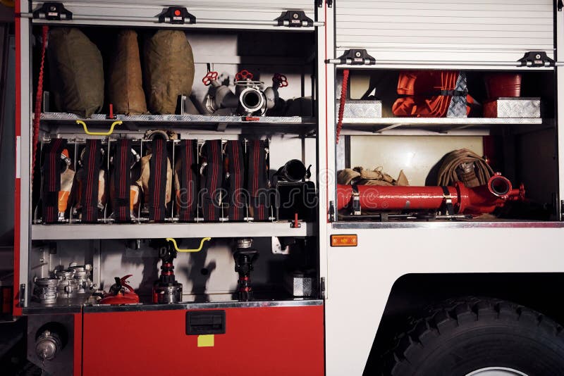 Inside of Fire Truck. Close Up View of Equipment and Hoses Stock Photo ...