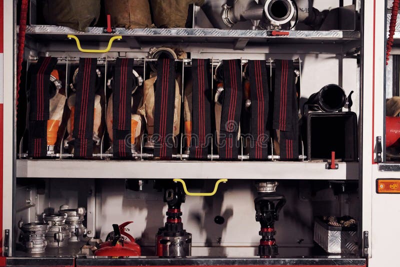 Inside of Fire Truck. Close Up View of Equipment and Hoses Stock Photo ...