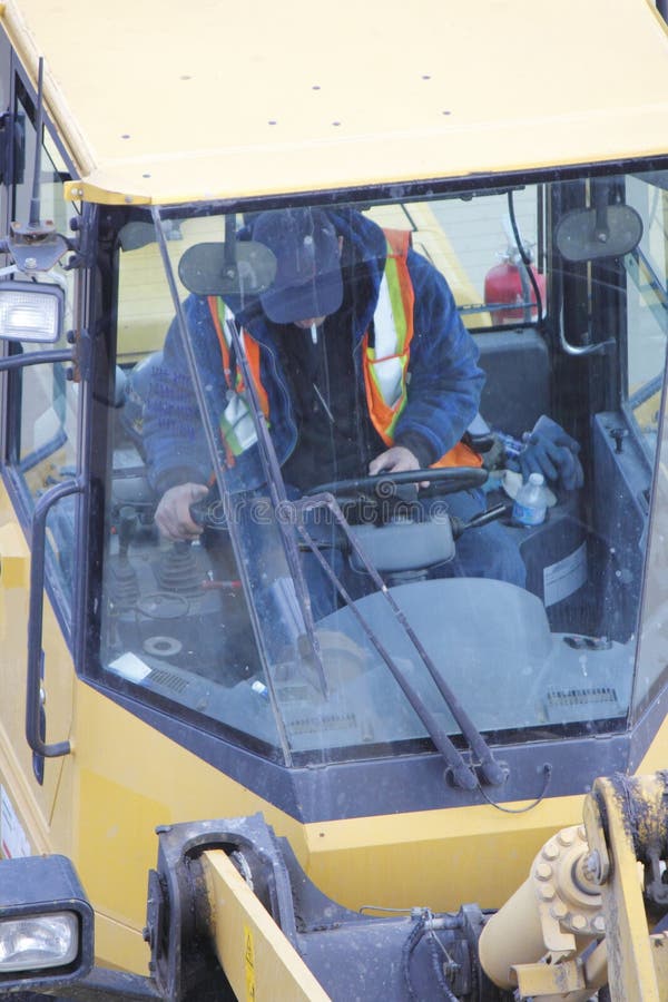 Construction Worker Climbing a Wheel Loader Stock Photo - Image of ...