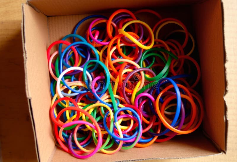 From Inside a Half Empty Box of Rubber Bands Tangled and Colorfu Stock ...