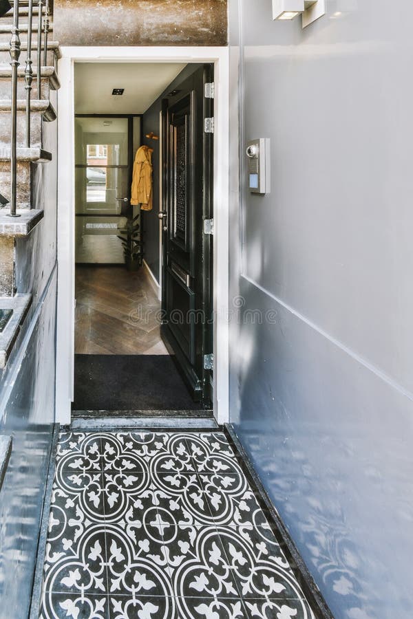 A Hallway with a Black and White Patterned Rug Stock Image - Image of ...