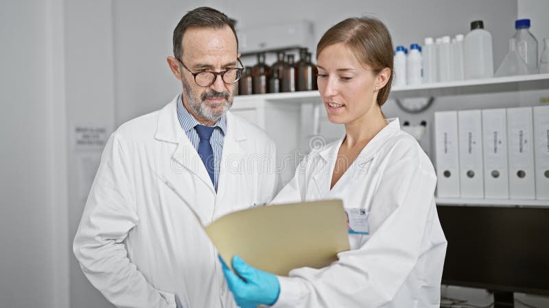 Inside the Lab, Two Passionate Scientists Engrossed in Conversation ...