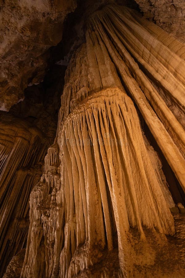 Inside a Limestone Cave, Tall Stalactites and Stalagmites Create an ...