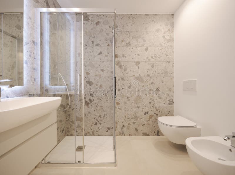 Inside a Modern Bathroom with Marble Tiles Stock Image - Image of ...