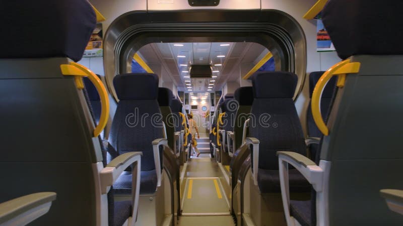 A Modern Passenger Intercity Train Travels at Night in Transit. the ...