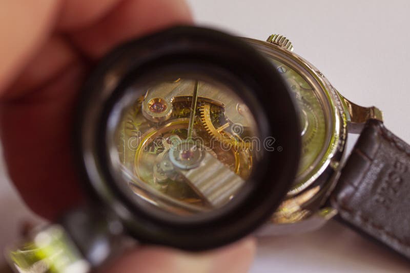 Inside of Watch Seen through Magnifying Glass at Watchmaker. Stock ...