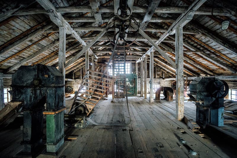 Inside Old Abandoned Wooden Mill with Old Equipment Stock Photo - Image ...