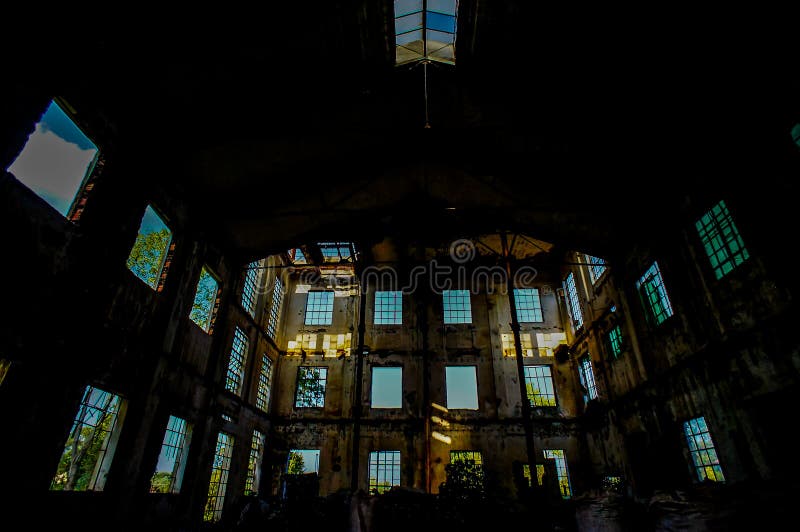 The Inside of an Old Building with Many Windows and a Large Open Space ...