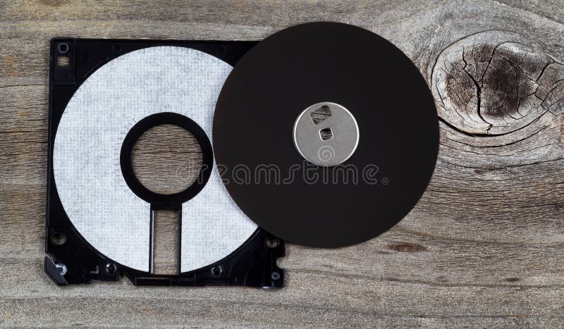 Inside Parts of an Old Computer Diskette on Aged Wood Stock Image ...