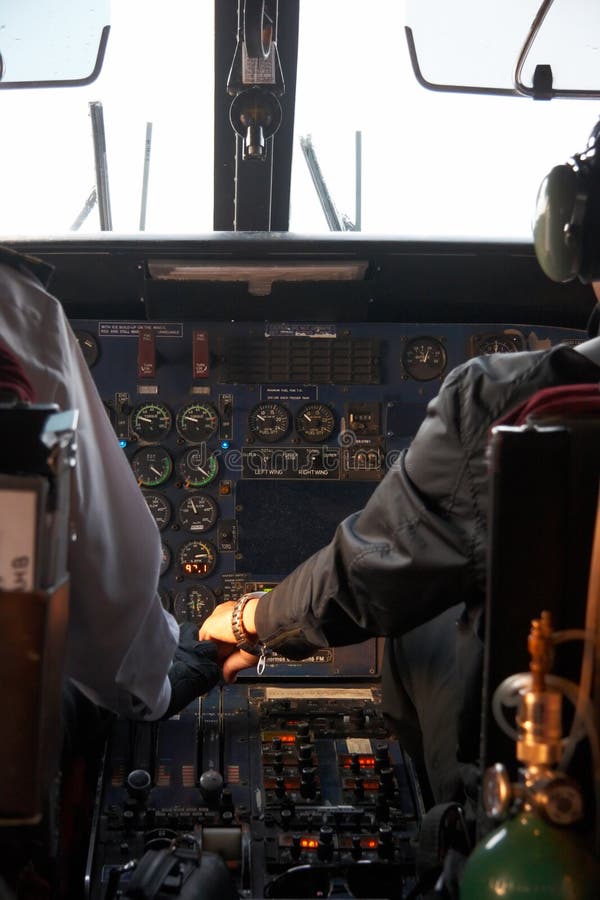 Airplane Pilots in Cockpit Preparing To Takeoff Editorial Stock Image ...