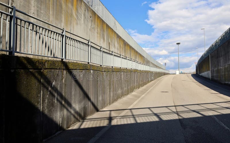 Inside a Road Underpass Bordered with Two High Concrete Wall. Blue ...