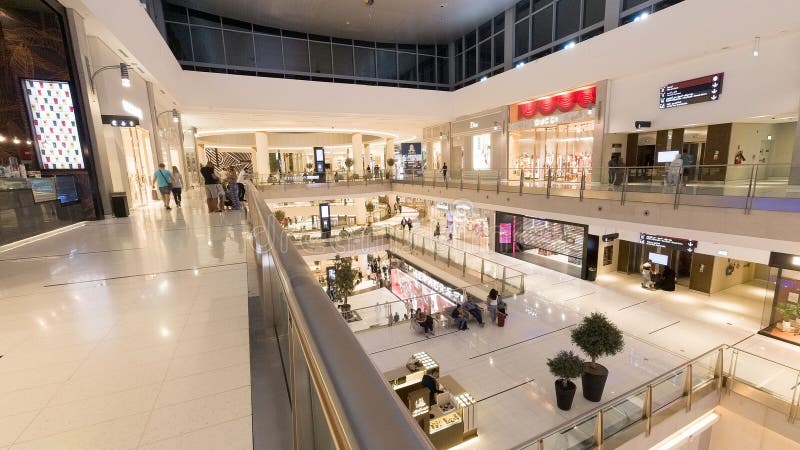 A Shopping Mall with Bright Lights of the Stores in Dubai, UAE ...