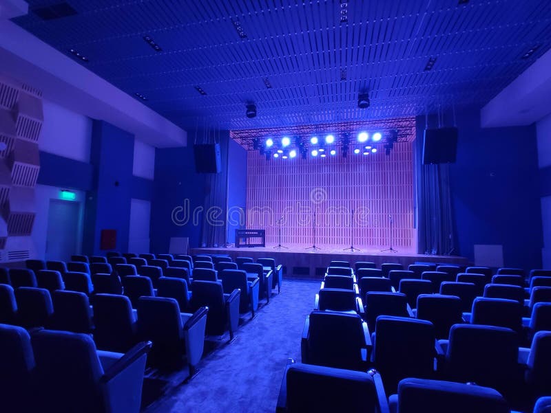 Inside Shot of a Small Empty Auditorium with Four Microphones on the ...