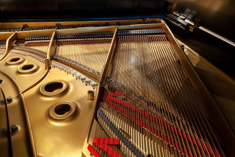 Inside of a Small Baby Grand Piano with Strings and Brass Coloring ...