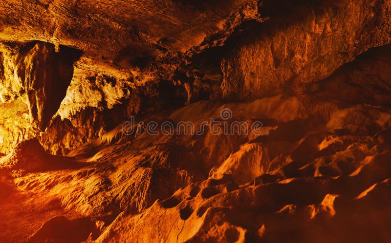 Inside stone cave of hell stock photo. Image of inferno - 157638104