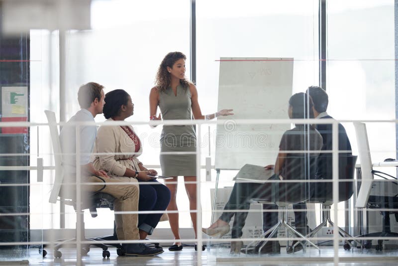 Inside the Think Tank. a Group of Colleagues Brainstorming in an Office ...