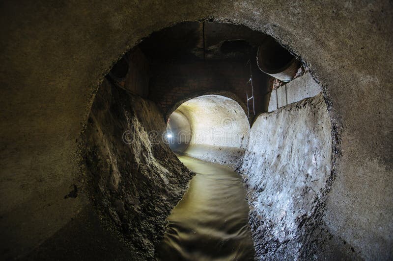 Inside Underground Urban Sewer System. Sewage Flowing in Round Sewer ...