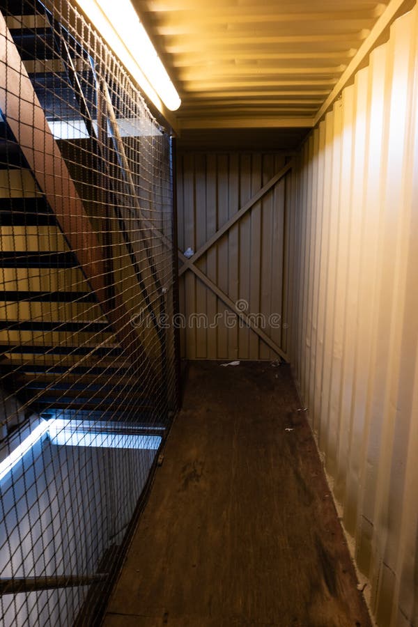 Inside View of Converted Shipping Container with Stairs and Artificial ...