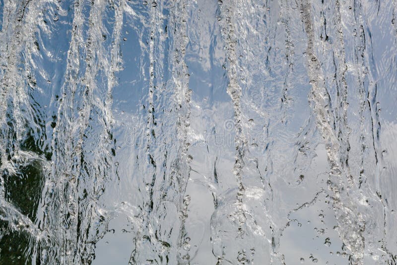 Inside View of the Falling Water of the Waterfall Against the Blue Sky ...