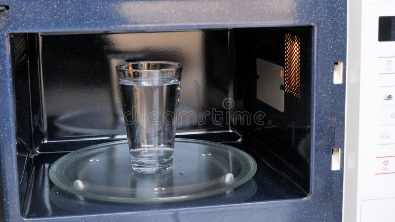 Inside View of a Glass of Water Heating in the Microwave Stock Photo ...