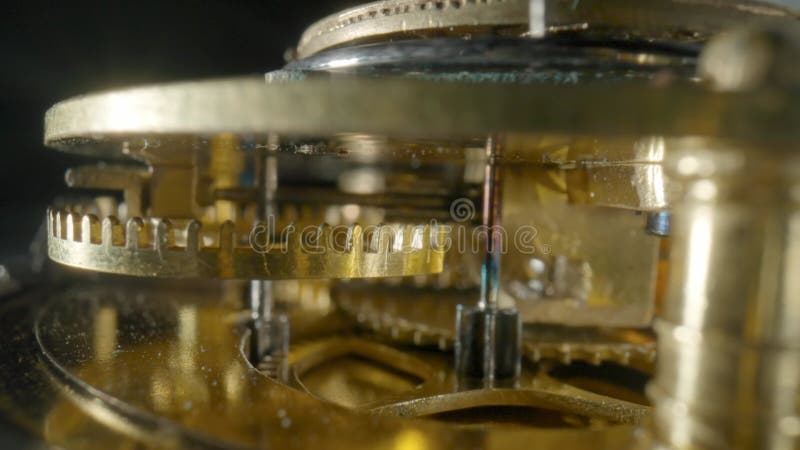 Inside View of a Moving Clockwork of Golden Mechanical Clock on Black ...