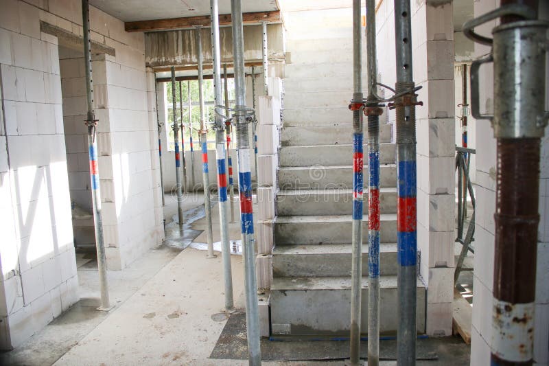 Inside View of a New Building with Concrete Stairs and Support Beams ...