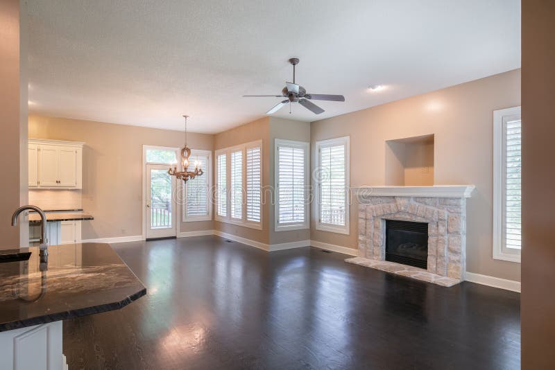 Inside View of a Room with White Walls, Windows, and a Fireplace ...