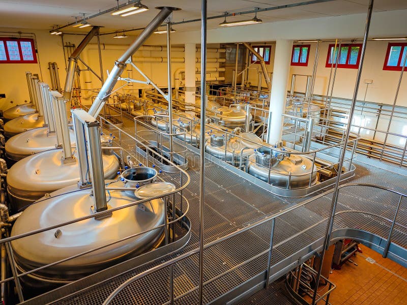 Inside a Winery. Wine Cellar with with Steel Barrels for Fermentation ...